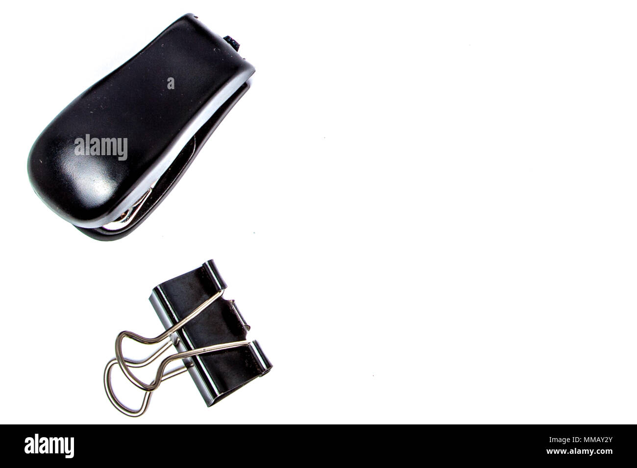 staple puller or staple remover and paper clips isolated on white ...