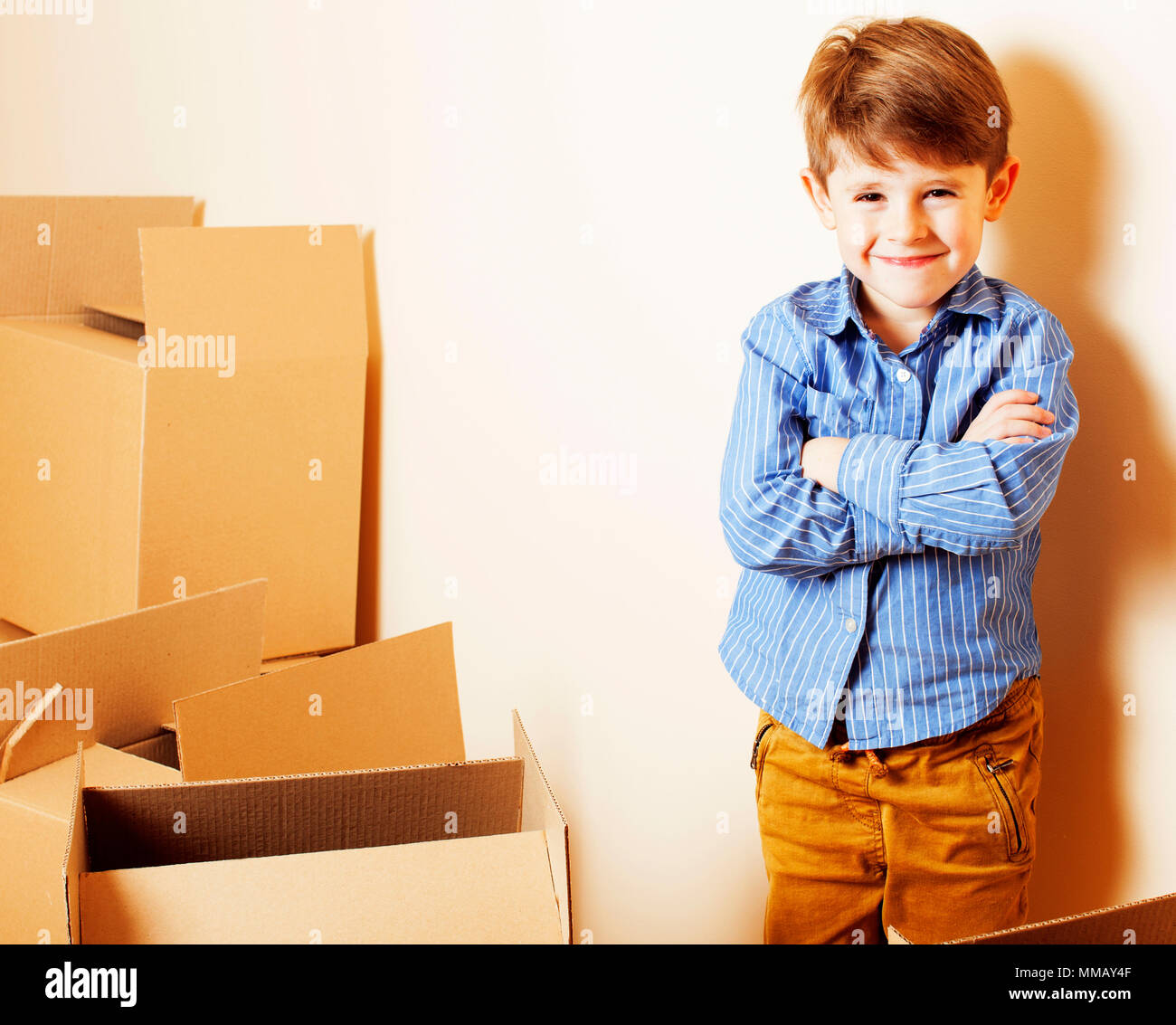 little cute boy in empty room, remoove to new house. home alone Stock ...