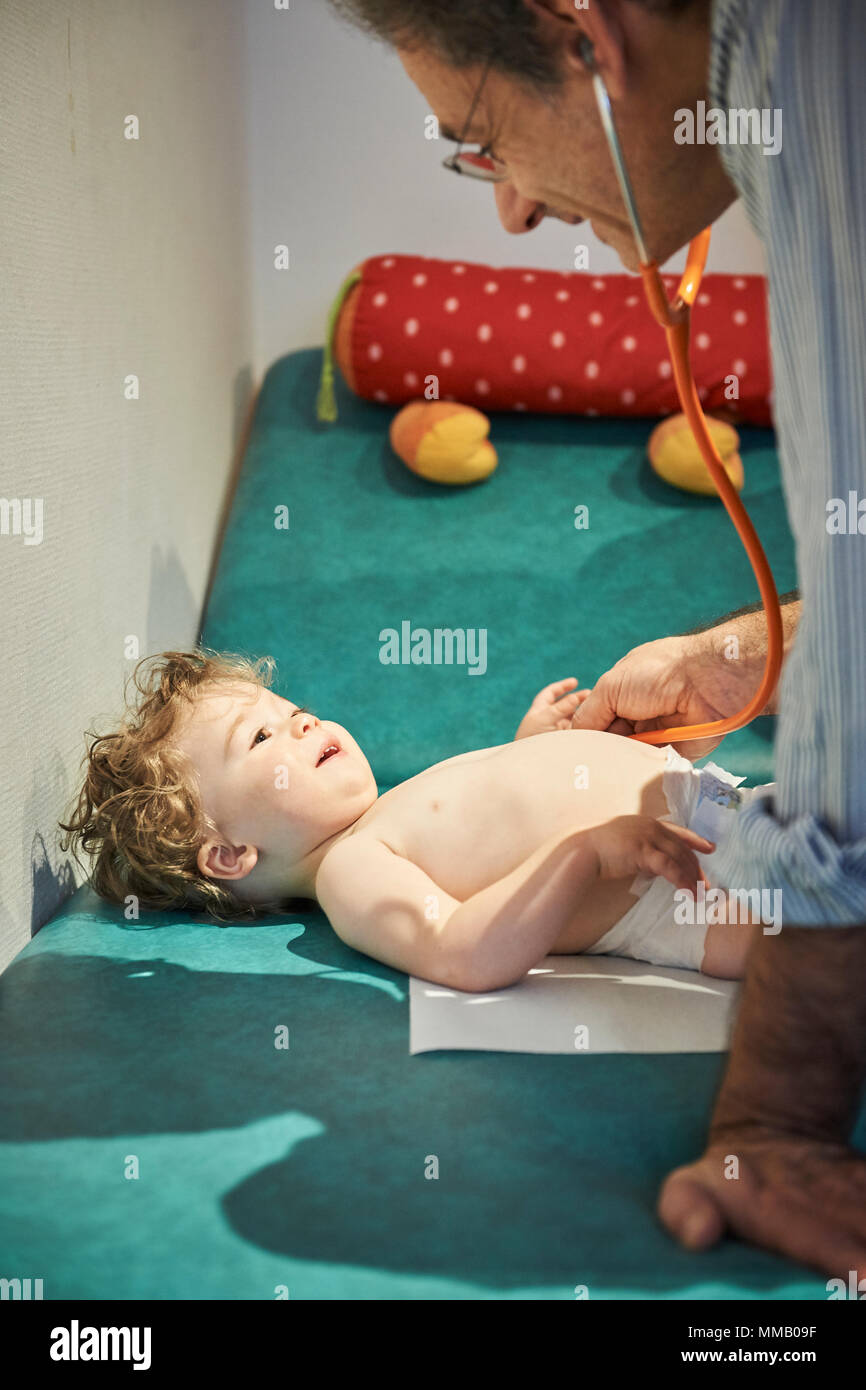 Examination of patients health childrens doctor hi-res stock ...