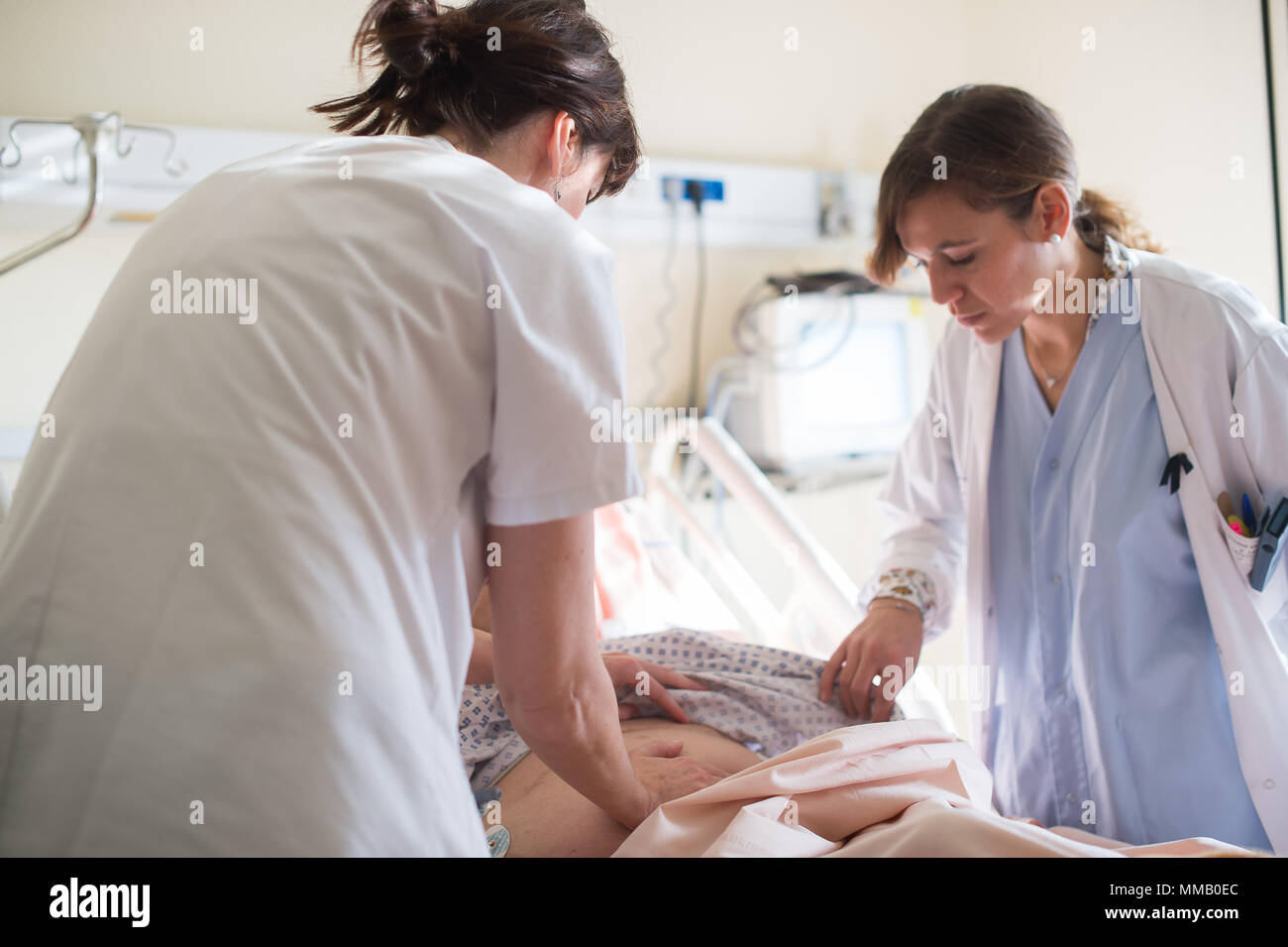 Doctor palpating the abdomen hi-res stock photography and images - Alamy