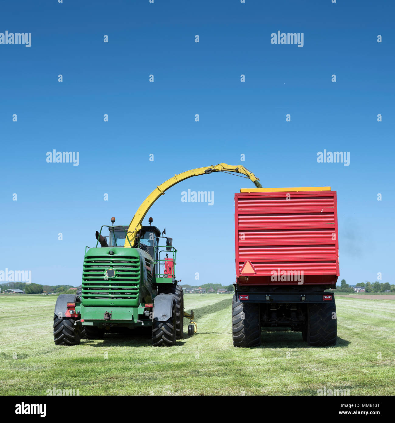 Combine harvester loads tractor hi-res stock photography and images - Alamy