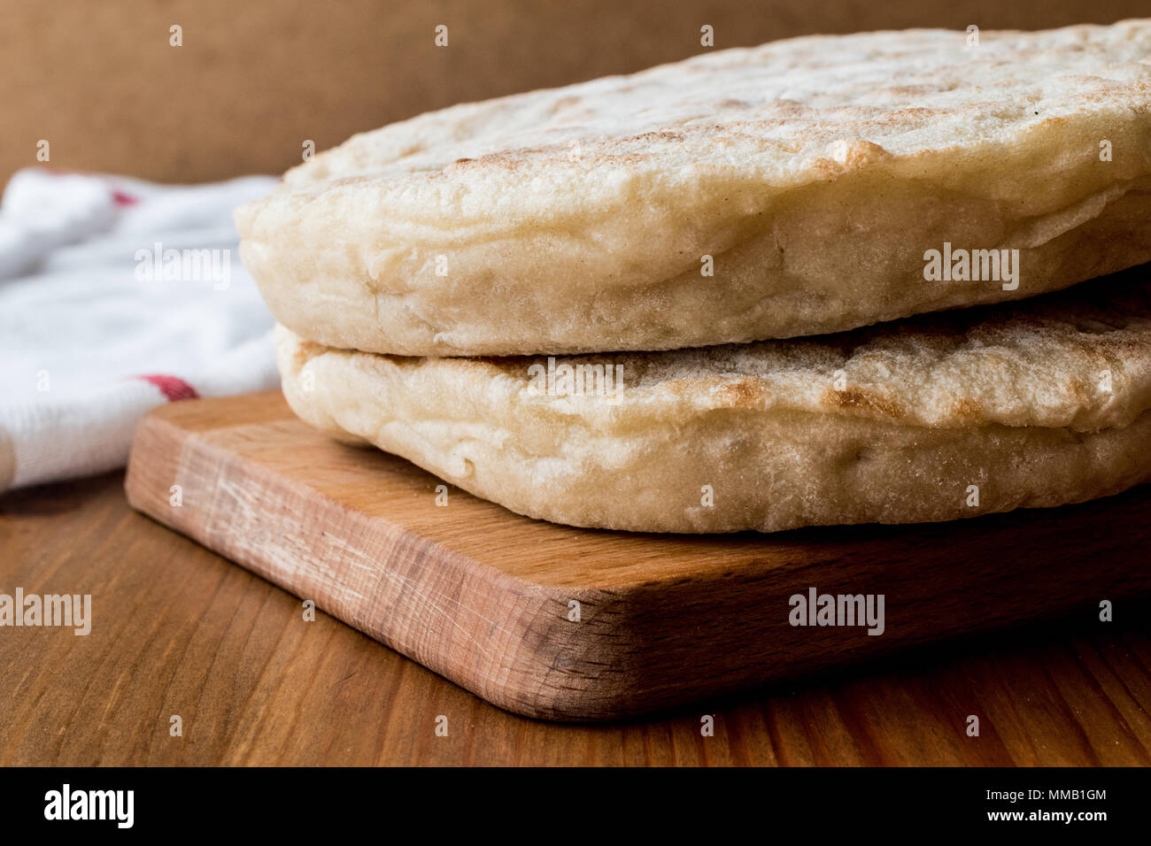 Turkish Bread Bazlama on wooden surface. Traditional Bakery Concept ...