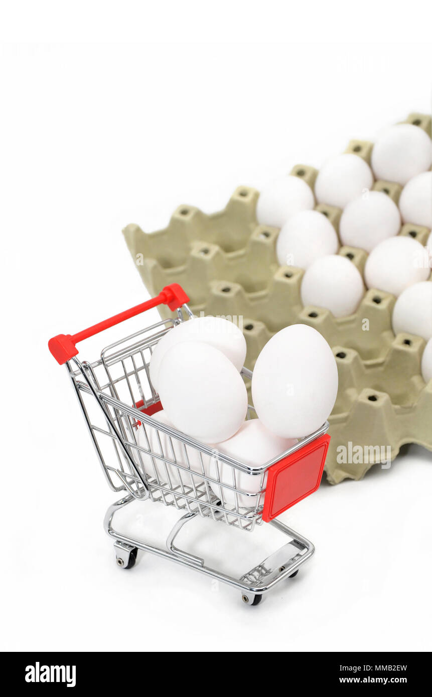 Shopping cart with eggs and egg crate on a white background Stock Photo ...