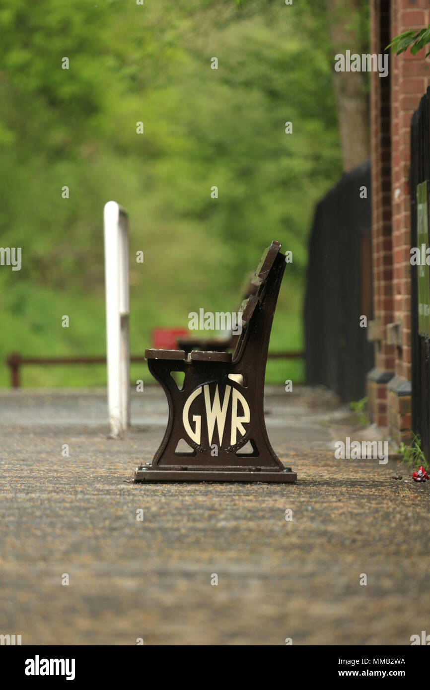 Traditional brown GWR (great western railway) bench on a platform on ...