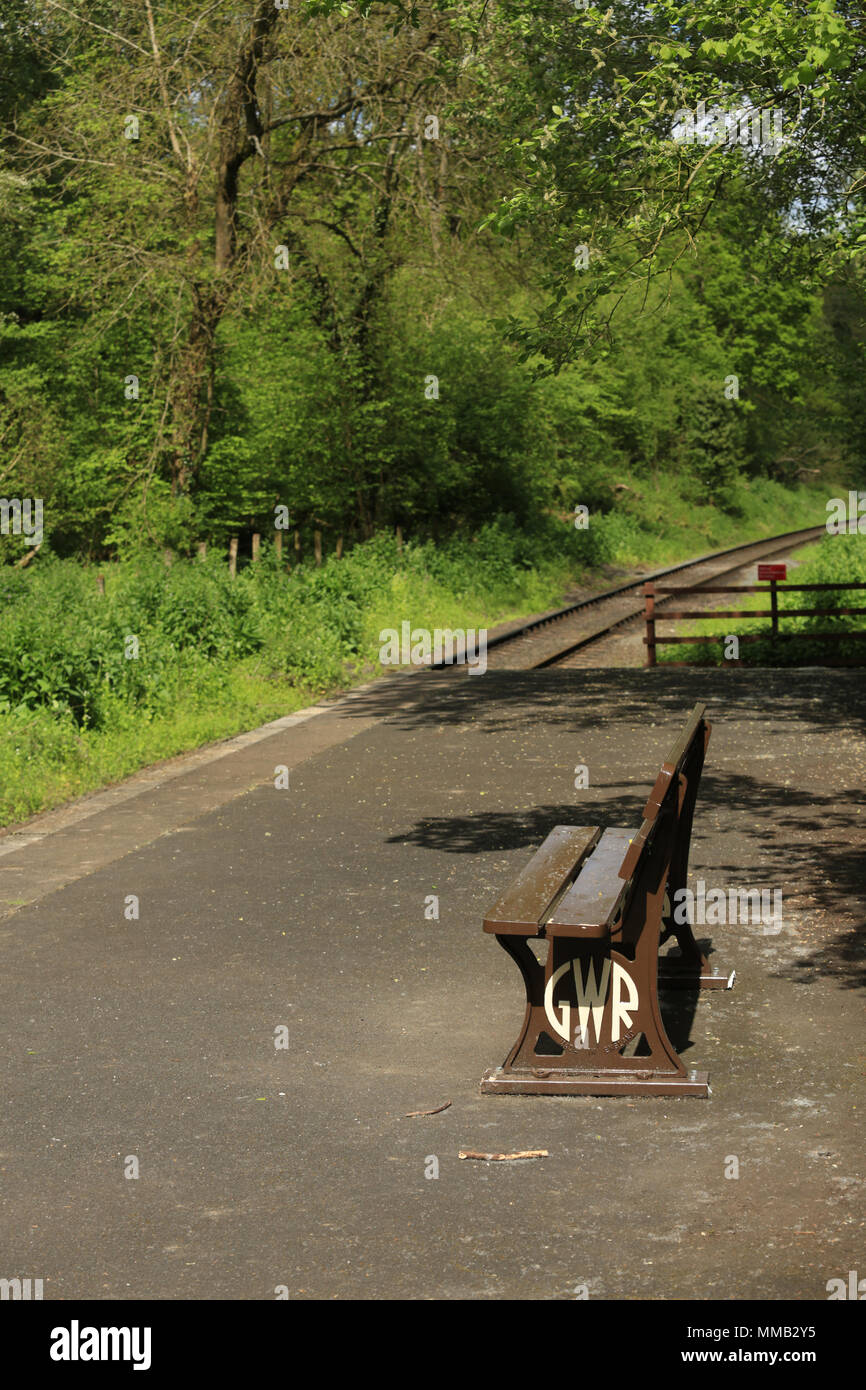 Traditional brown GWR (great western railway) bench on a platform on ...