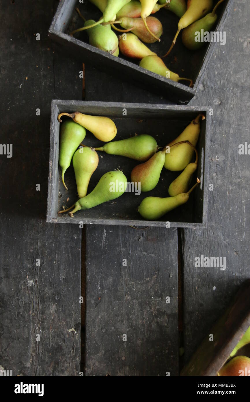 Fall pears on wooden table Stock Photo - Alamy