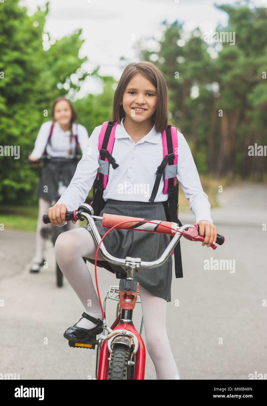 Girl riding bicycle road school hi-res stock photography and images - Alamy