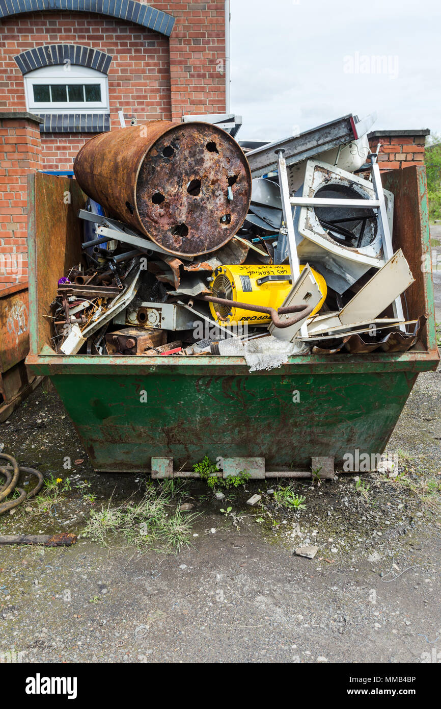 Skip or dumpster filled with waste metal ready for collection Stock ...