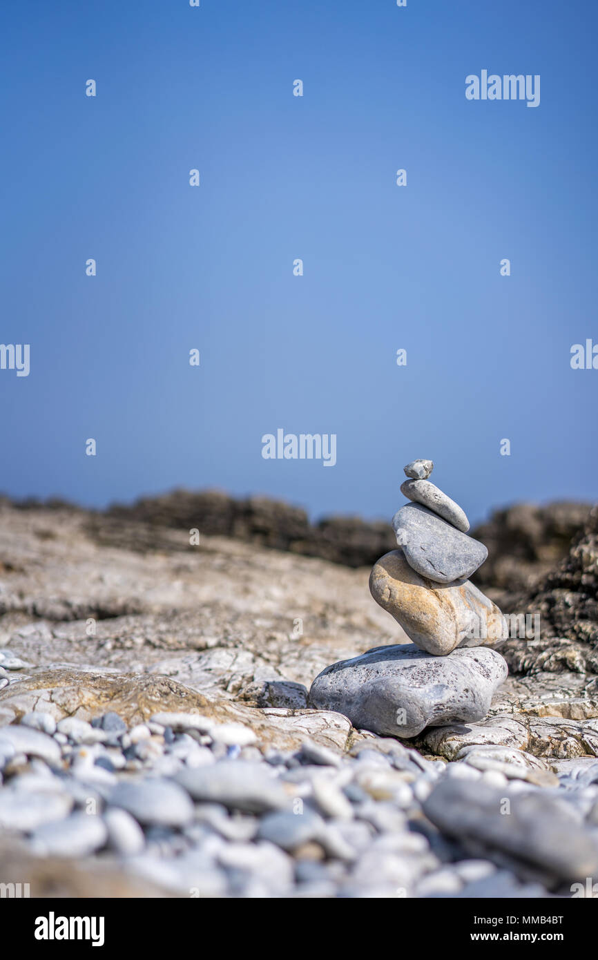 Balancing stones on a beach Stock Photo - Alamy
