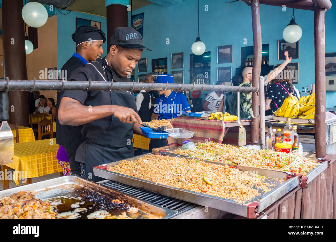 cuban man cooking at restaurant, havana, cuba Stock Photo - Alamy