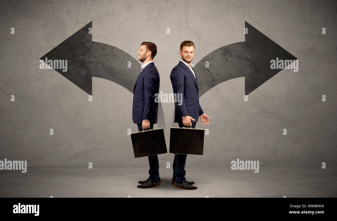 Young conflicted businessman choosing between two directions ...
