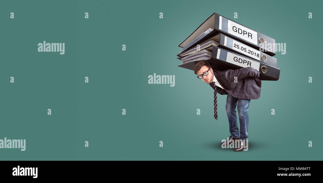 Man carrying an enormous stack of GDPR files Stock Photo - Alamy