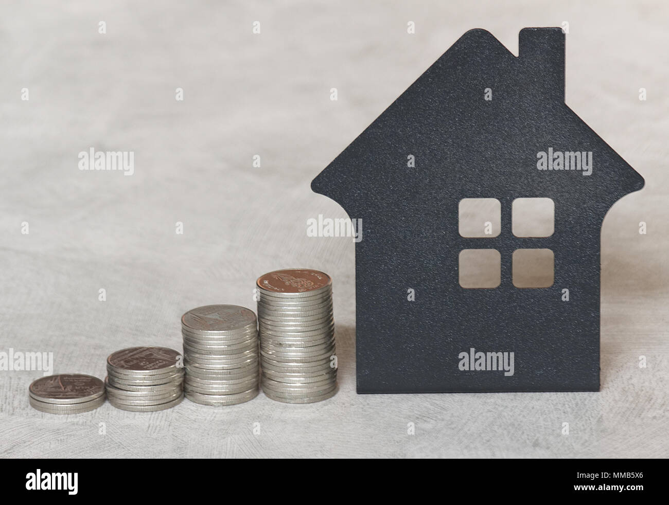 House coin stack hi-res stock photography and images - Alamy