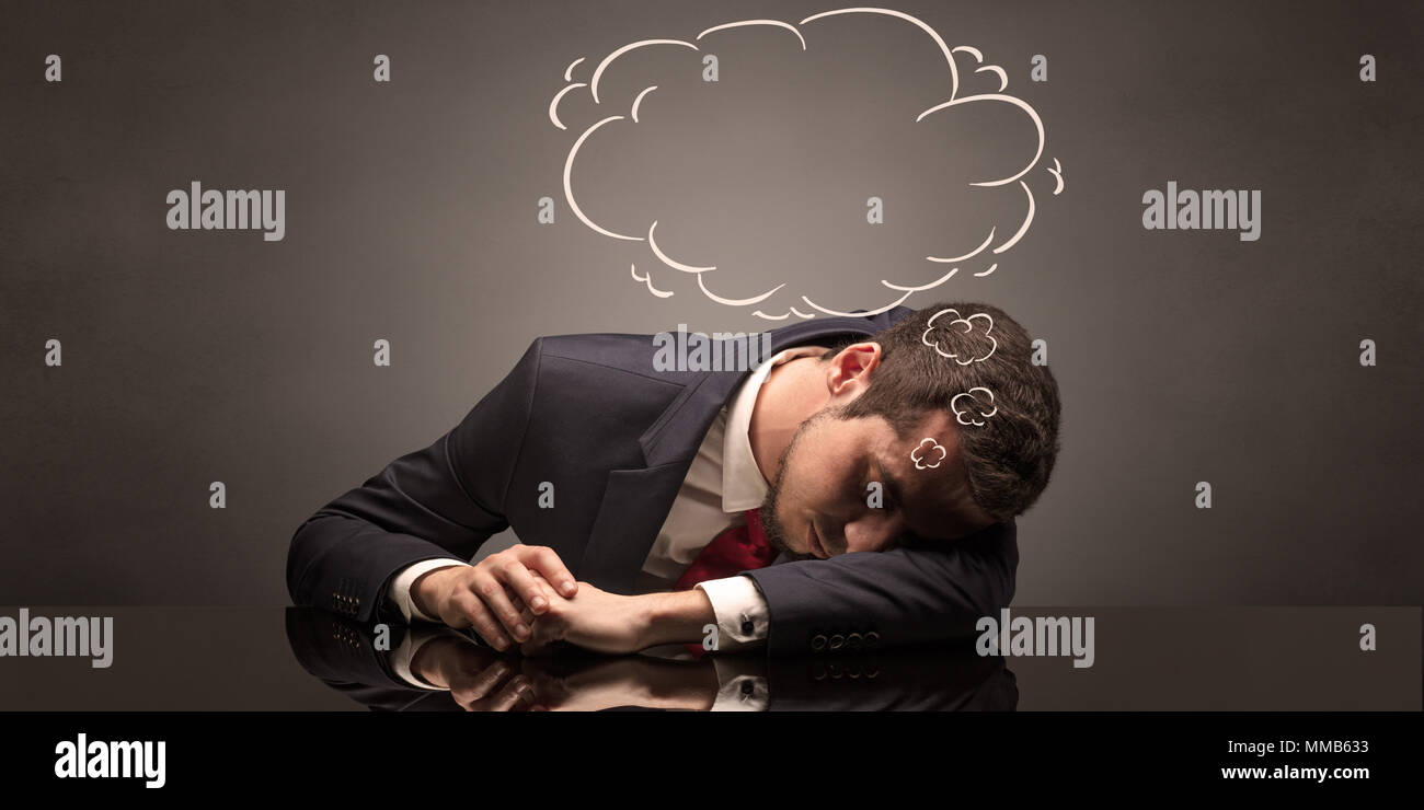 Young businessman sleeping and dreaming at the office Stock Photo - Alamy