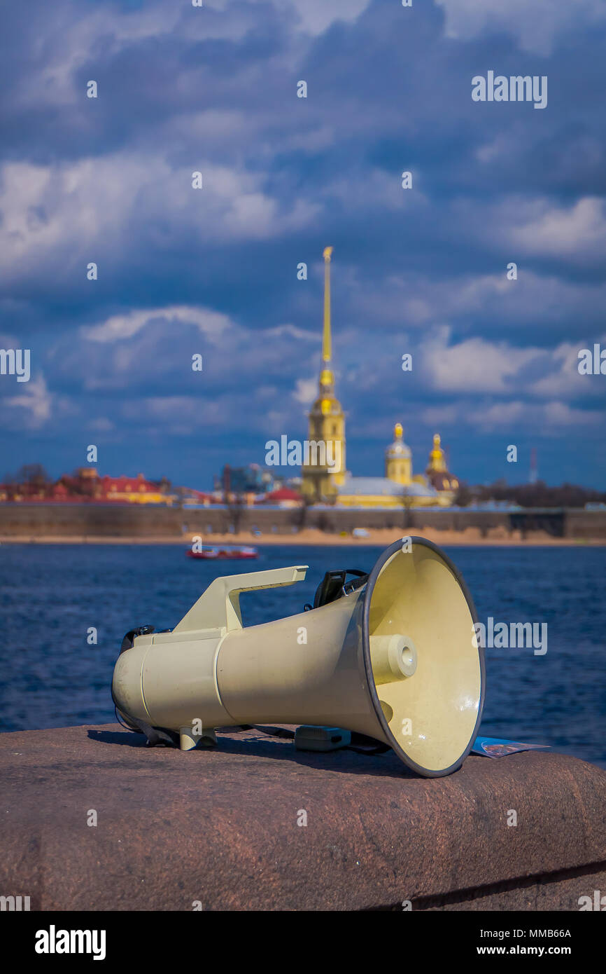 Close up of white megaphone at outsdoors with scenic river view of the ...