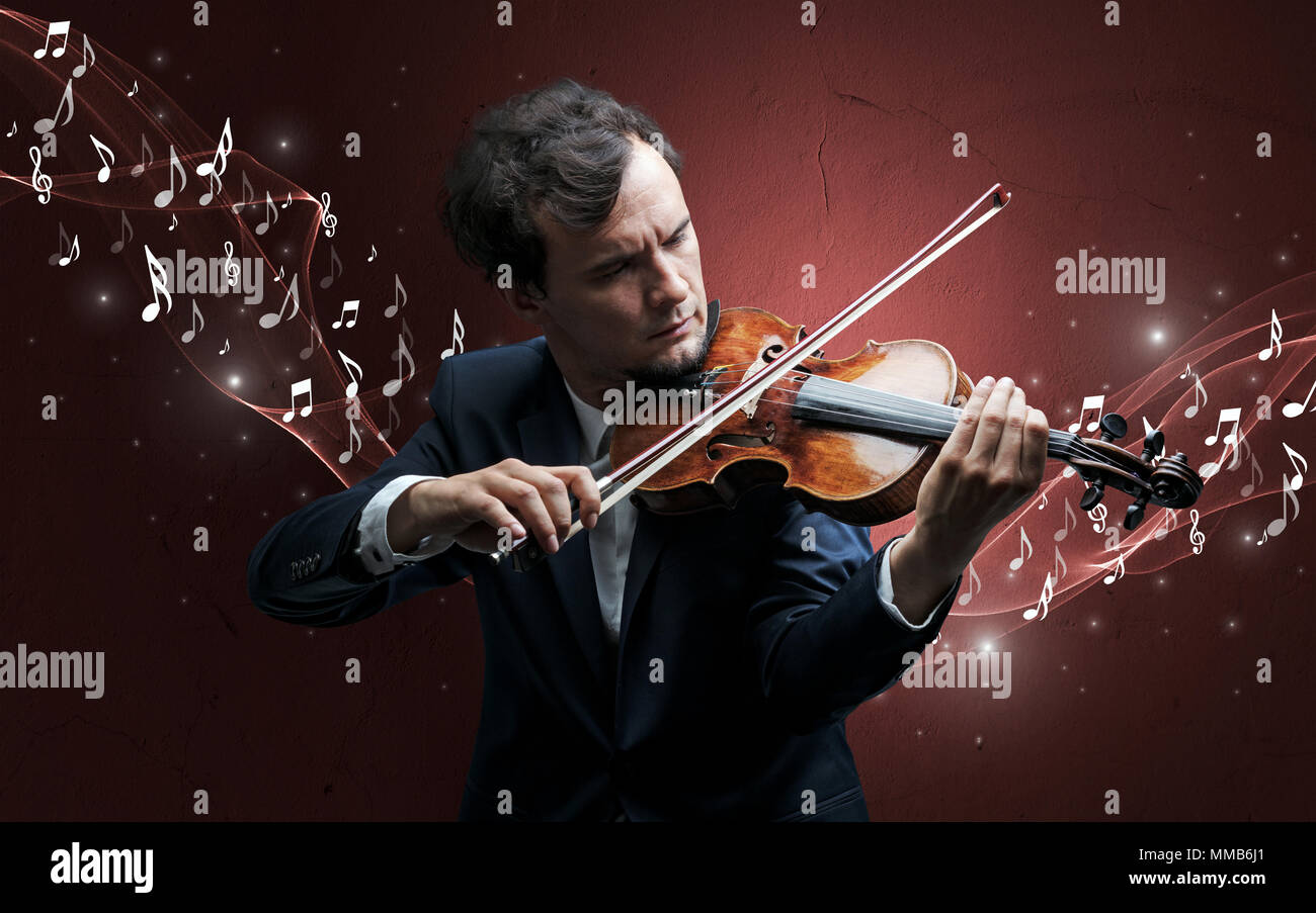 Lonely musical composer with violin and sparkling musical notes around ...