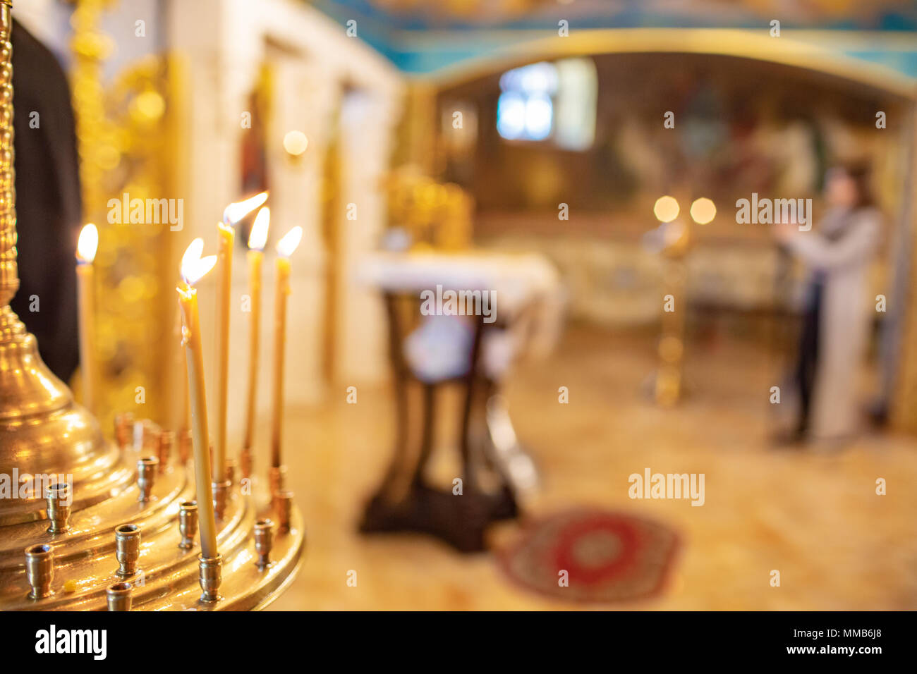 Candlestick with burning candles in church. religion Stock Photo - Alamy