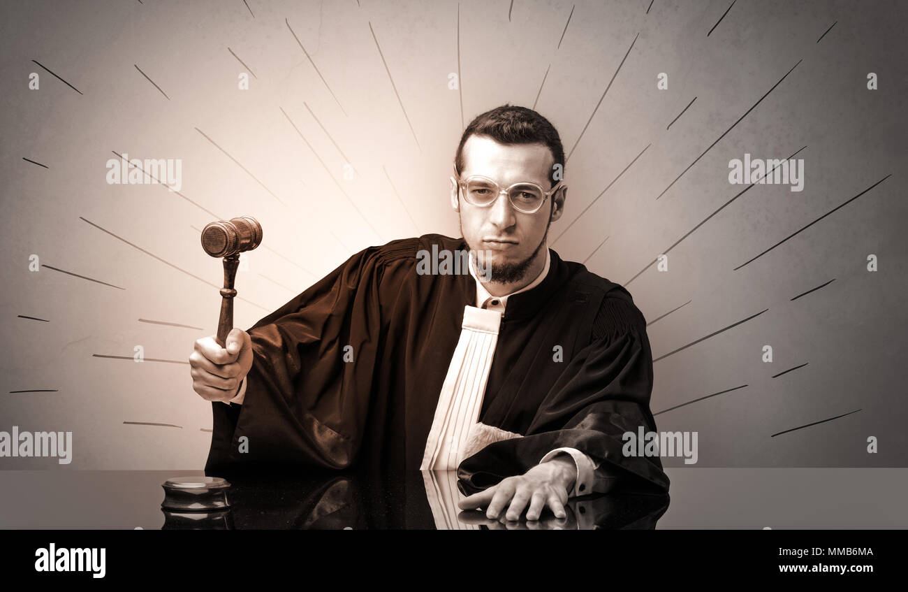 Young dashing judge in black gown making decision Stock Photo - Alamy