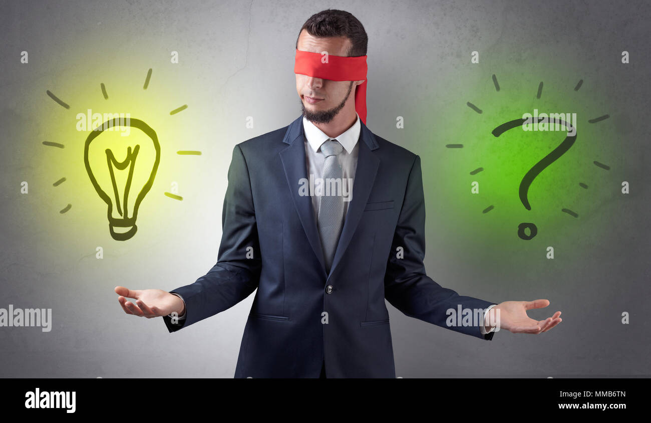 Covered eye businessman with bulb and question sign symbols around ...