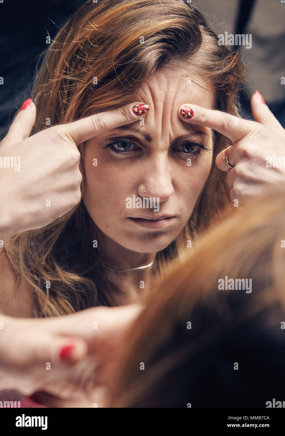 woman is very worried about her beauty Stock Photo - Alamy