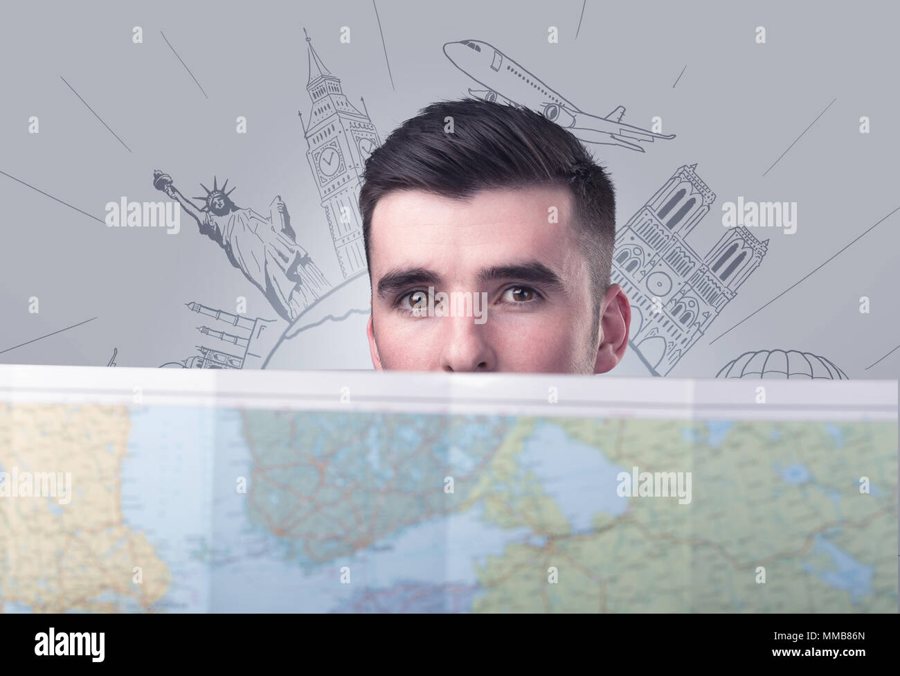 Handsome young man holding a map with famous sightseeing destinations ...