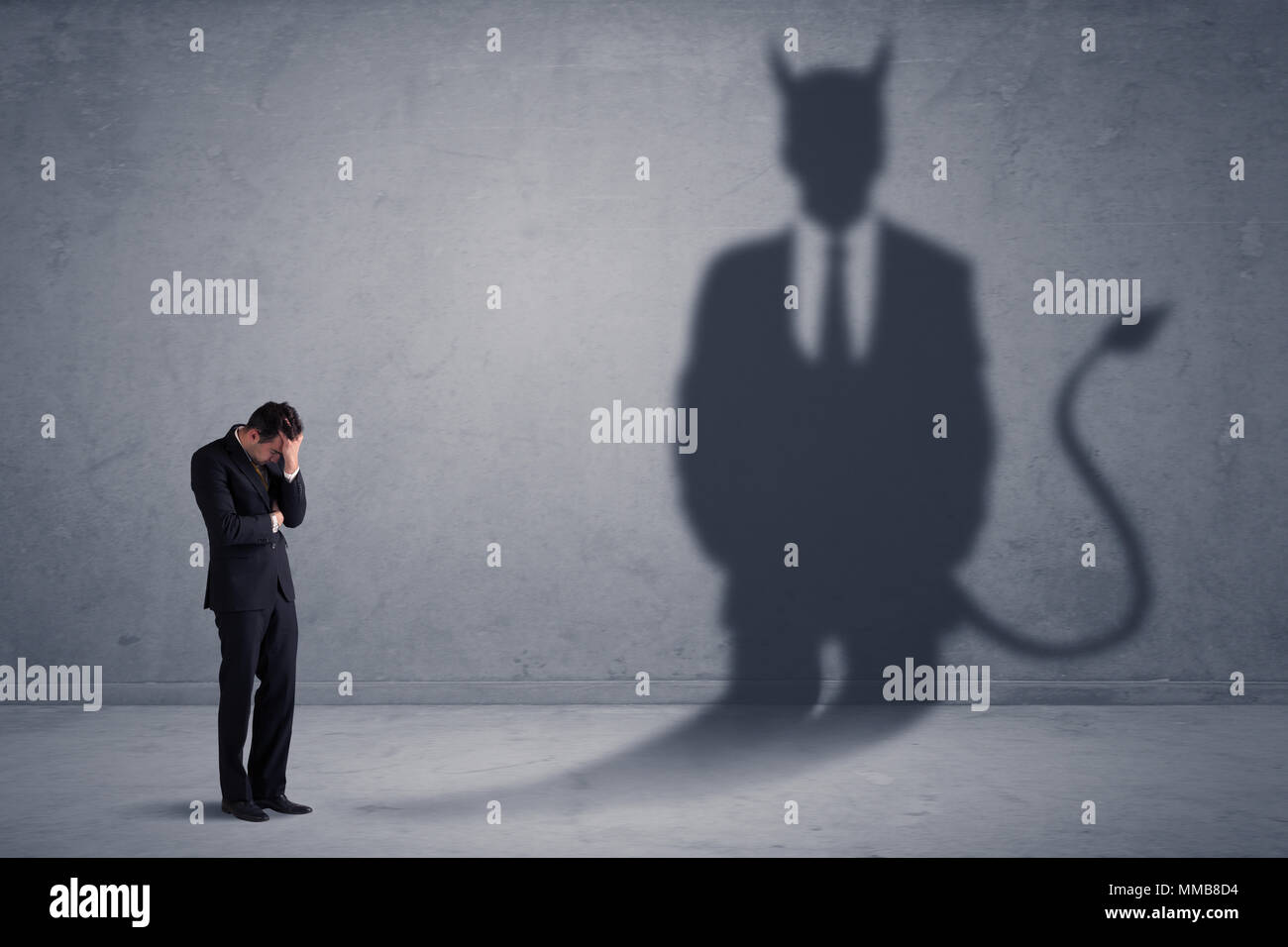 Business man looking at his own devil demon shadow concept background ...