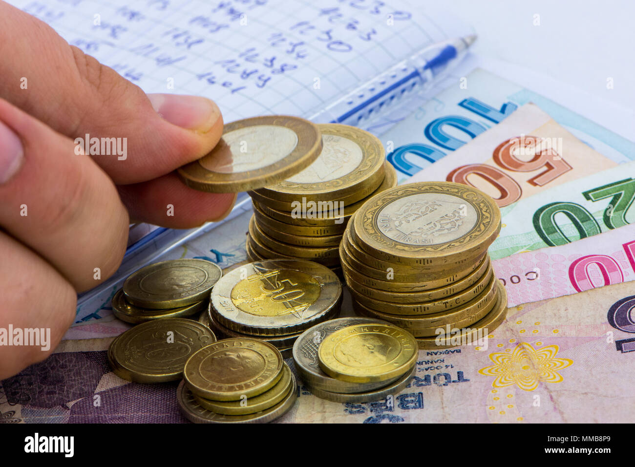counting and making calculations of the money in stock Stock Photo - Alamy