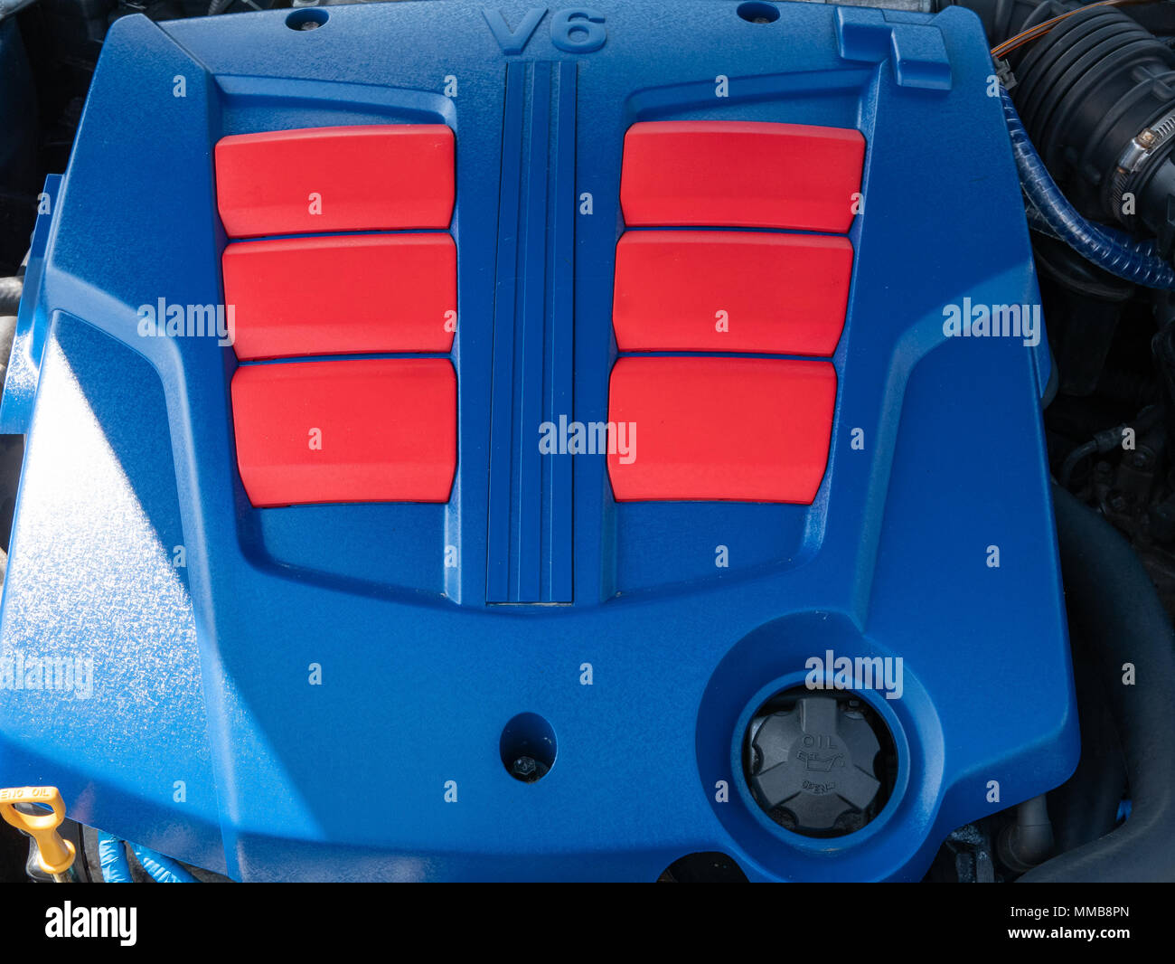 closeup of car vehicle engine covered by shiny plastic cover. closed ...