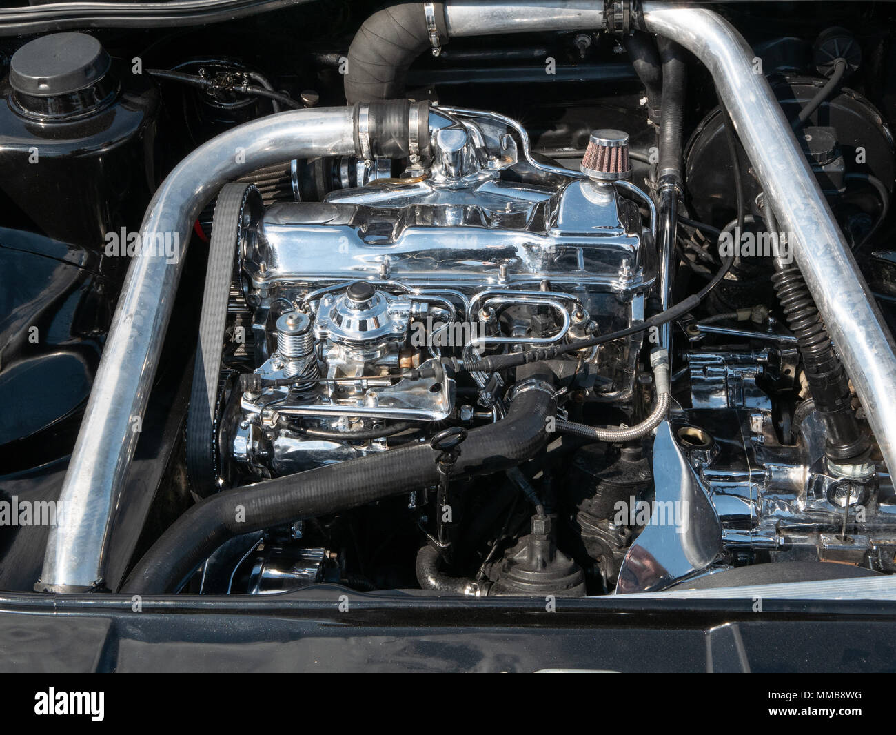 opened car hood vehicle engine compartment with chrome tubes parts ...