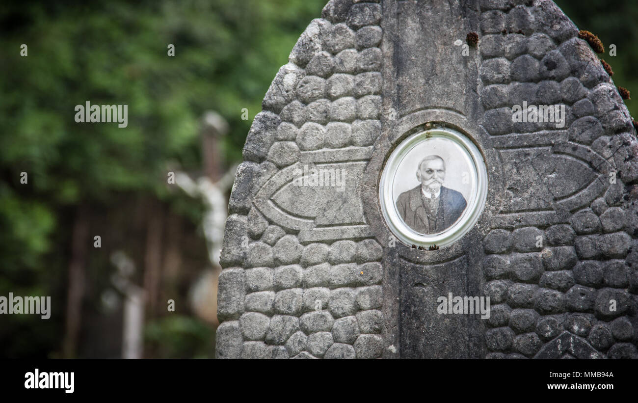Creepy old gravestone with face Stock Photo - Alamy