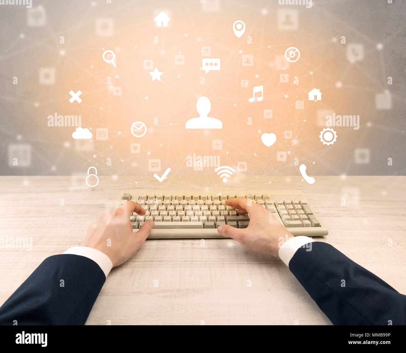 First person view of hand typing with social media concept icons around ...