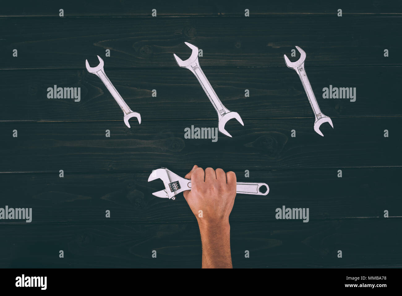 Hand holding wrench hi-res stock photography and images - Alamy