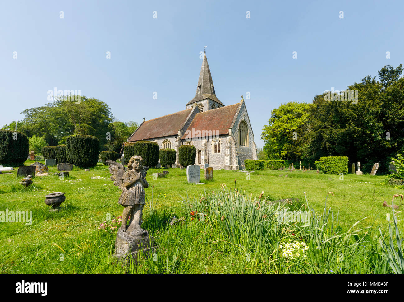 Stone angel statue child tombstone memorial at All Saints Parish Church ...