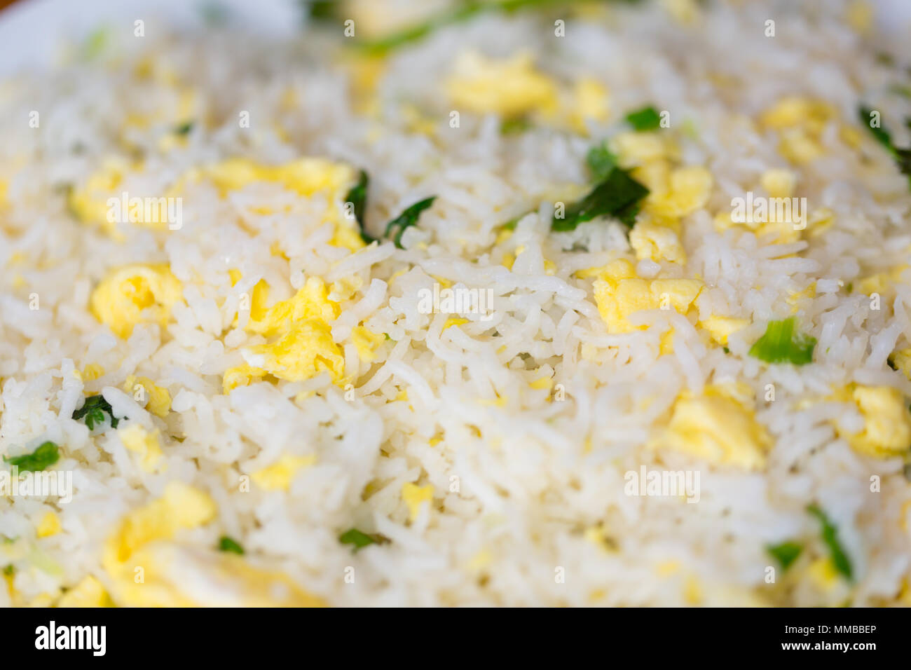 White steamed rice with slices of fried egg close up Stock Photo - Alamy