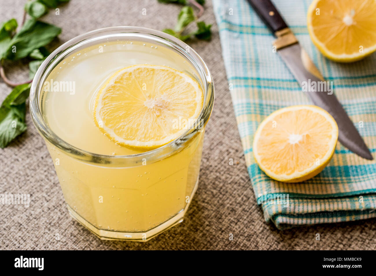 Lemonade drink of soda water with mint leaves and lemon. Summer ...
