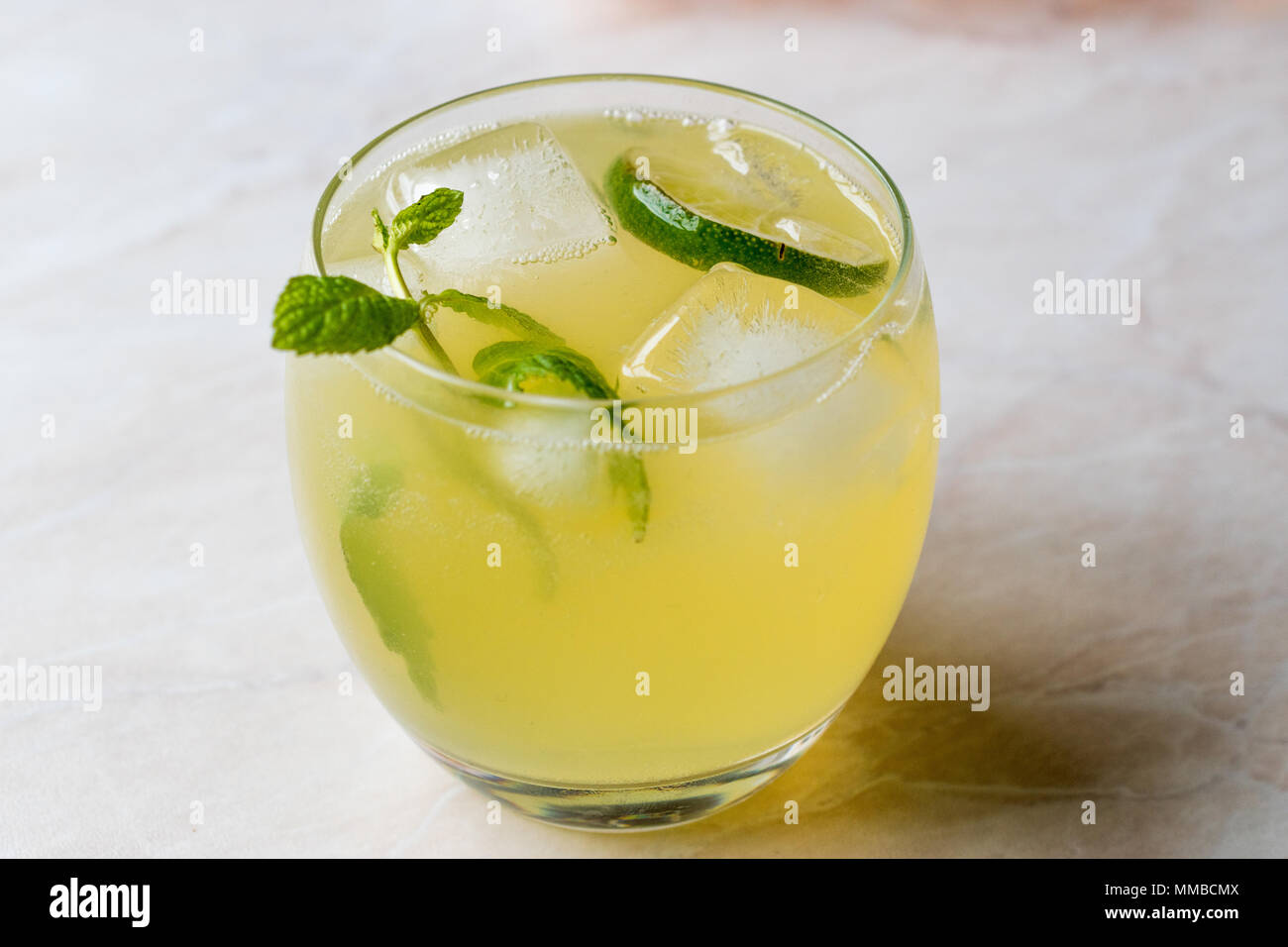 Yellow Lemonade Cocktail with Lime and ice. Beverage Concept Stock ...