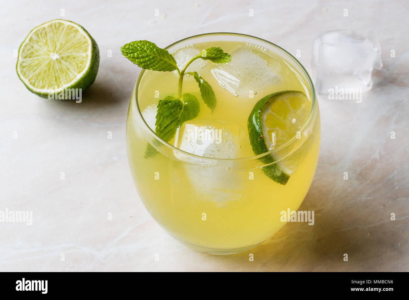 Yellow Lemonade Cocktail with Lime and ice. Beverage Concept Stock ...