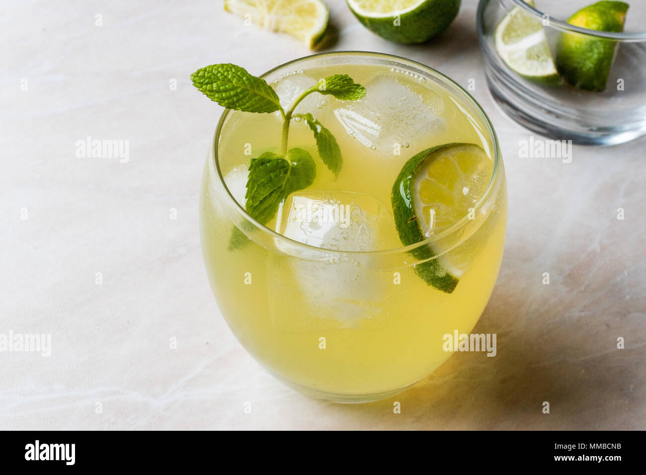 Yellow Lemonade Cocktail with Lime and ice. Beverage Concept Stock ...
