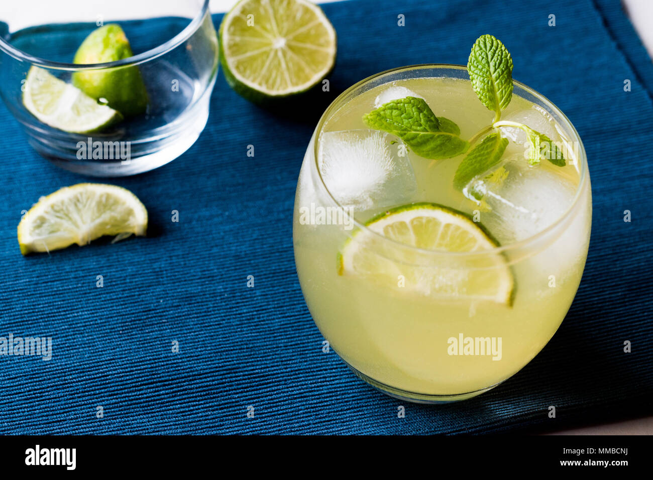 Yellow Lemonade Cocktail with Lime and ice. Beverage Concept Stock ...