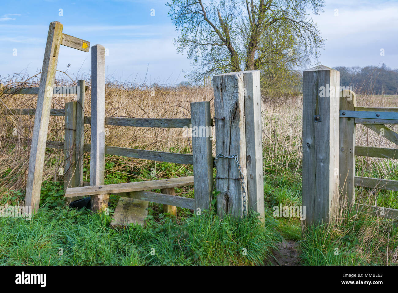 Wooden stile into a field on a public footpath in West Sussex, England ...