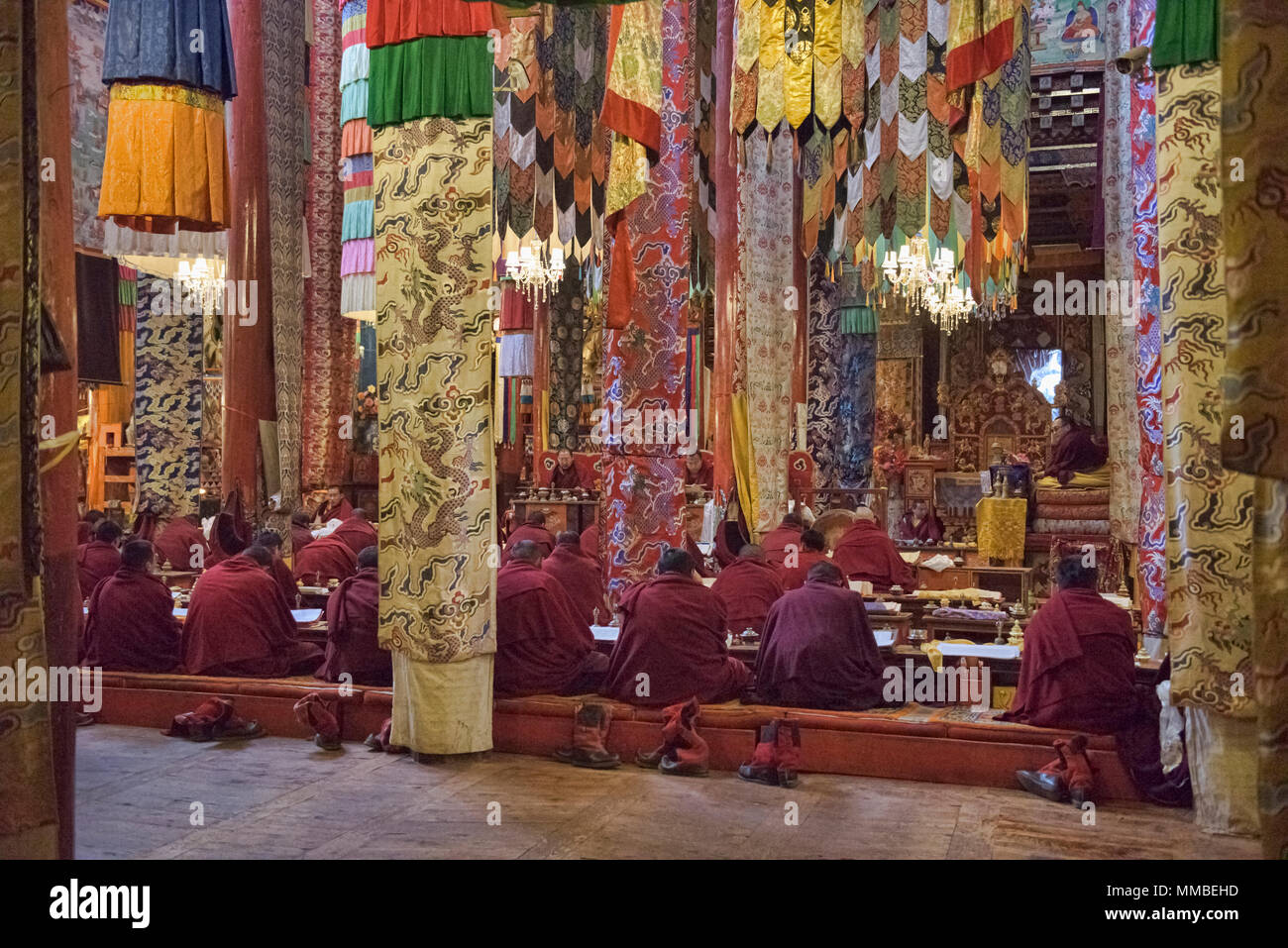 Tibetan monks inside the Gonchen Monastery in Dege, Sichuan, China ...