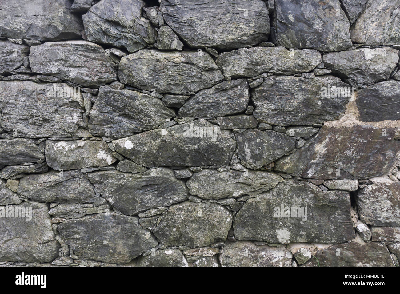 Old rustic stone wall background Stock Photo - Alamy