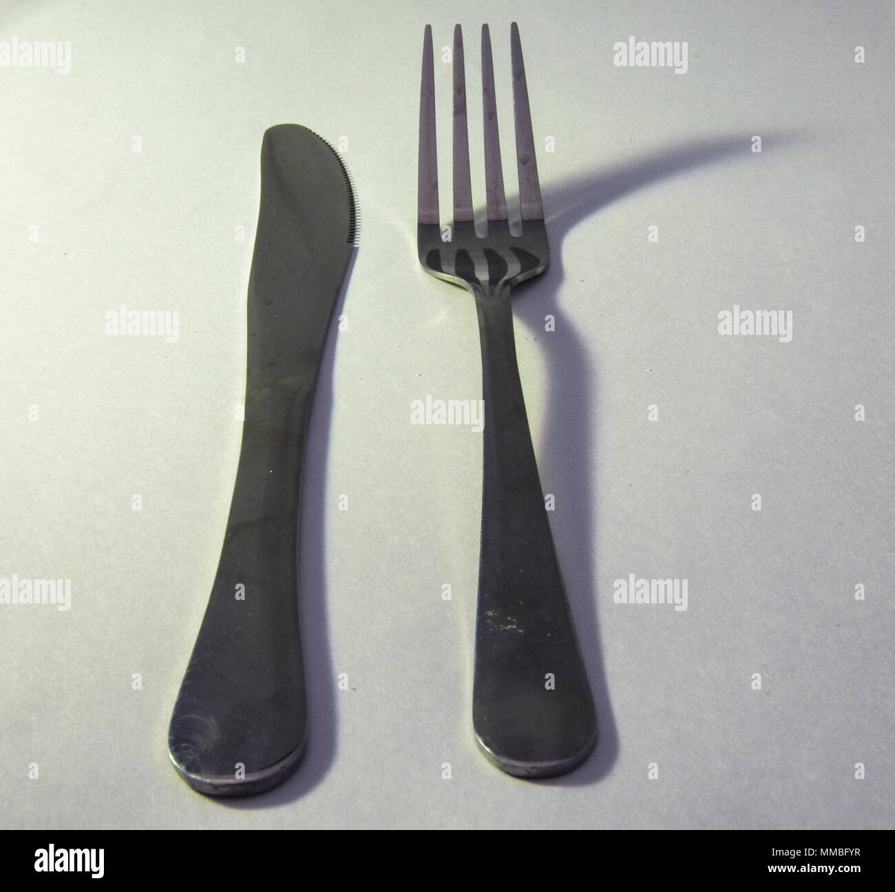 A stainless steel knife and fork from a cutlery set Stock Photo - Alamy