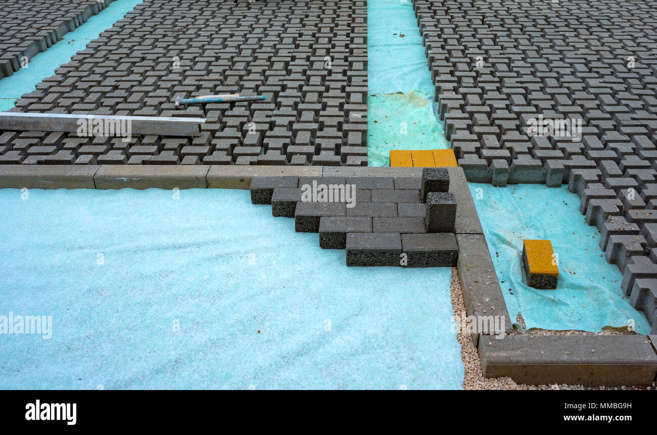 Heap of interlocking paving stones; Material for paving works on sheet ...