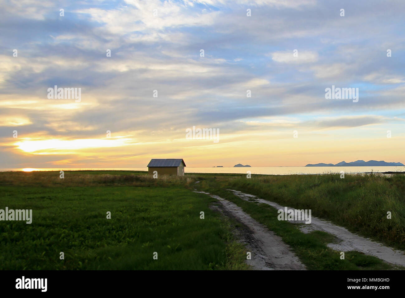 Beautiful yellow house at the coast of Lofoten Islands with view to the ...
