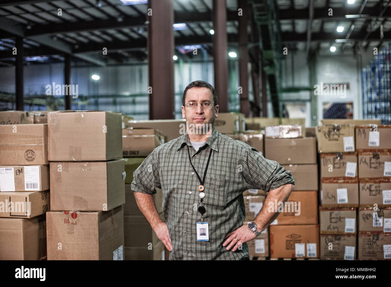 Portrait of a causcasian warehouse worker in a large distribution ...