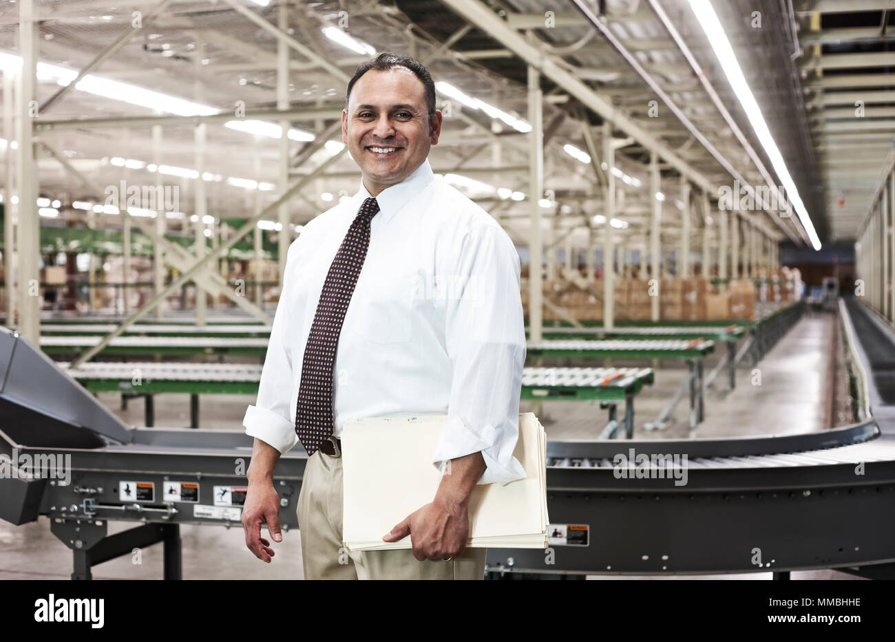 Portrait of a male Hispanic American executive in a shirt and tie ...