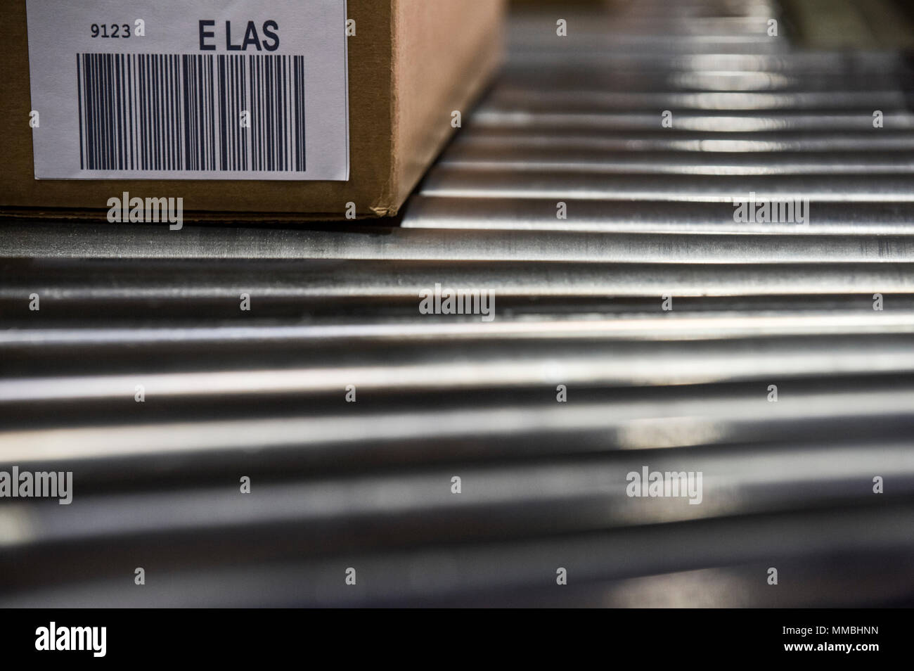 Close up of shipping labels with bar codes on cardboard boxes sitting ...