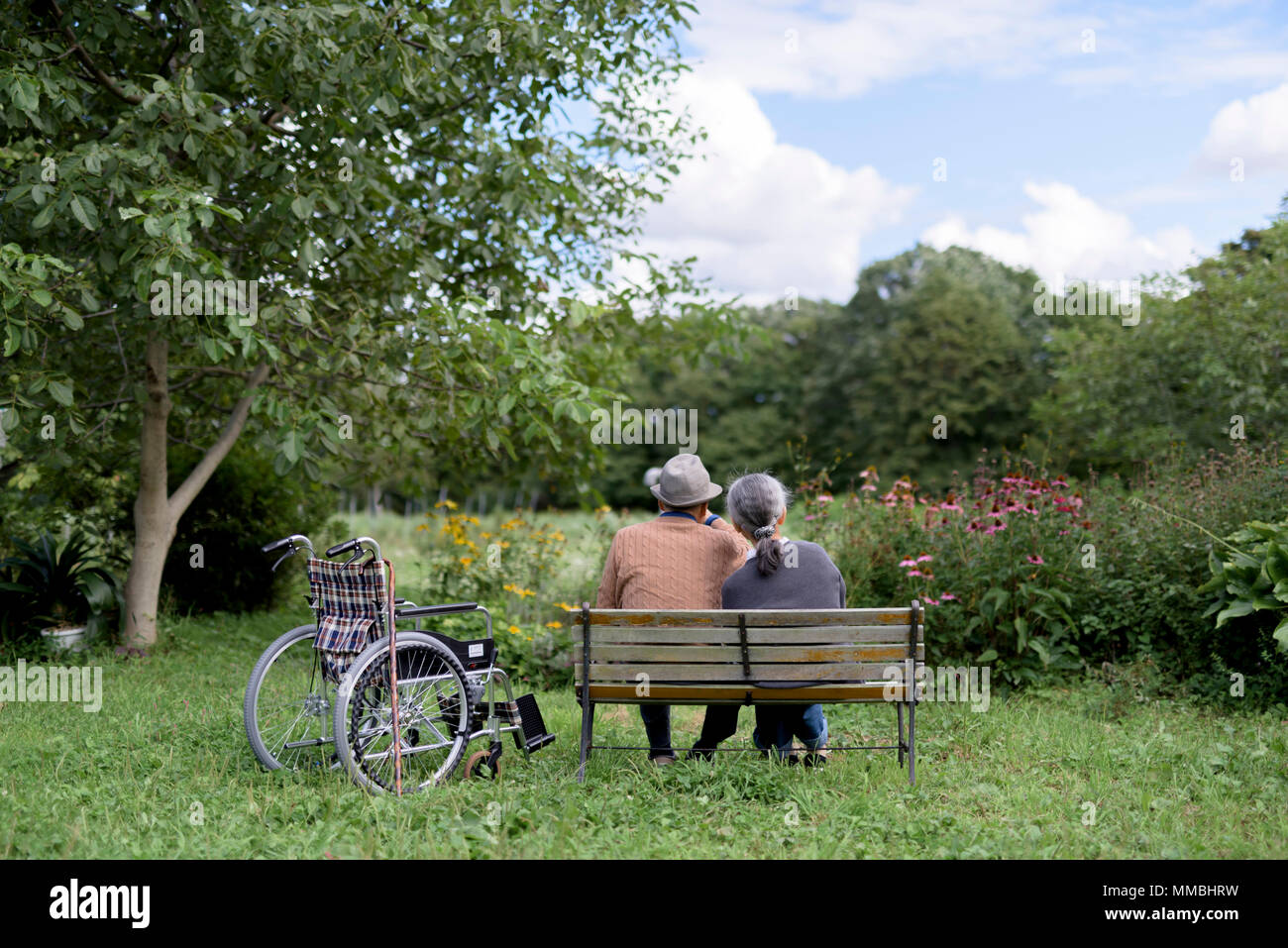 Elderly people sitting on seat rear view hi-res stock photography and ...