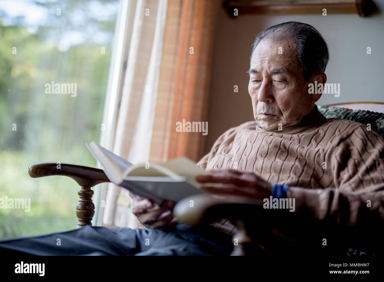 Man in a rocking chair hi-res stock photography and images - Alamy